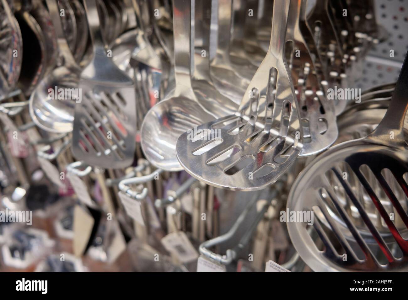 Chrome colored spoons and other different kinds of kitchenware Stock ...