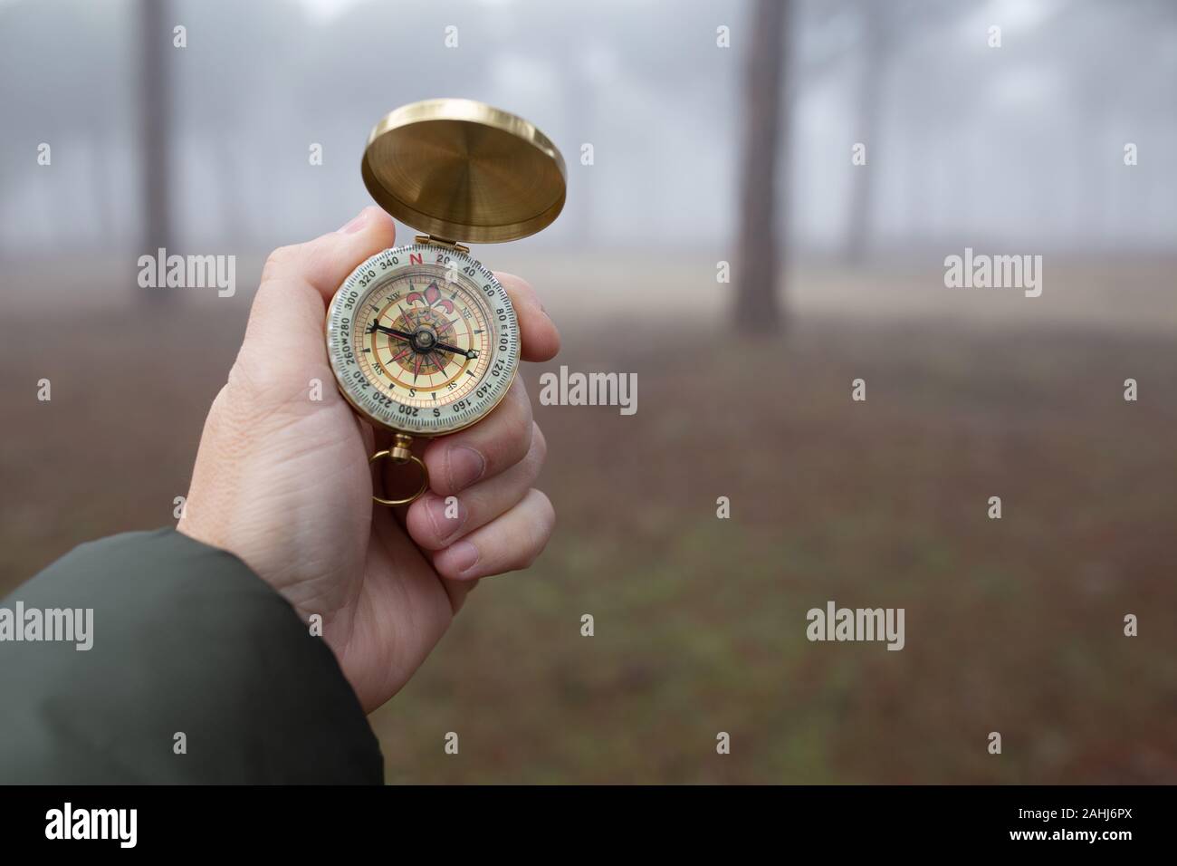 A person disoriented by the fog tries to find the right path with a ...