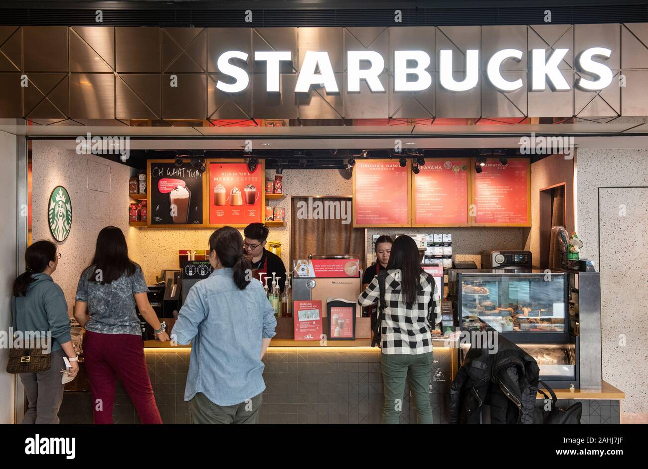 Customers ordering coffee at the American multinational chain ... Customers ordering coffee at the American multinational chain ...