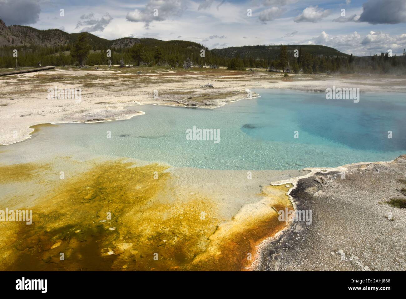 Geothermal lake with colorful mineral sediments in Yellowstone, Wyoming ...