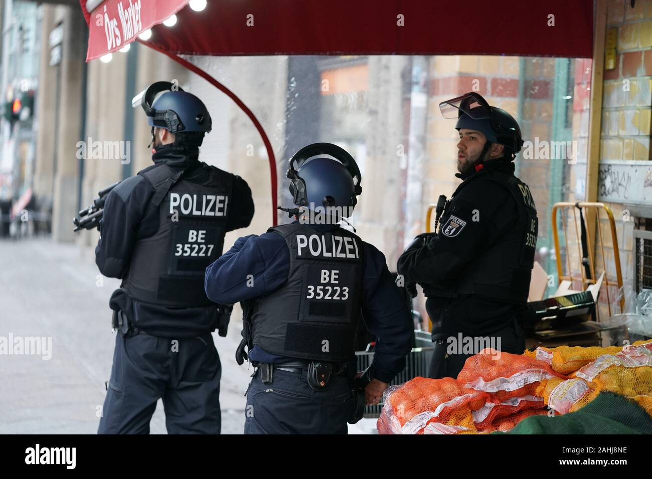 Berlin, Germany. 30th Dec, 2019. Police officers in protective gear are ...