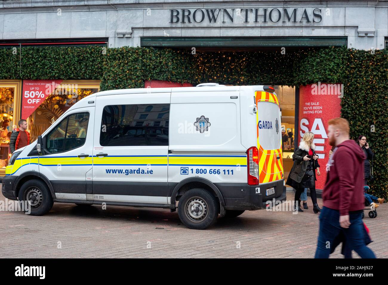Cork Ireland view of Police or Garda minivan and people out on the ...