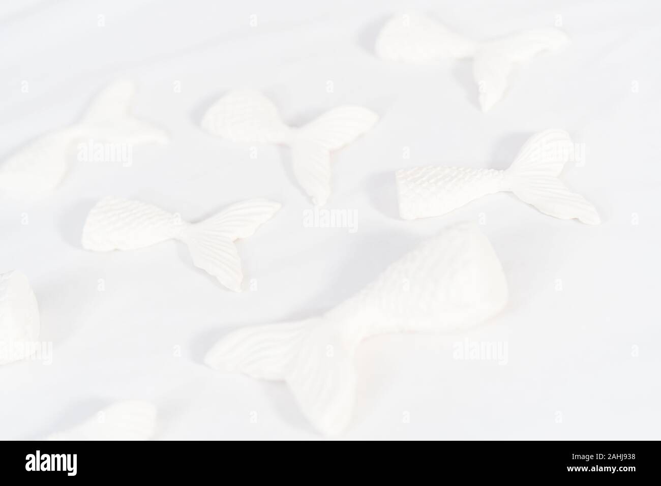 Modeling mermaid tails with white air-dry modeling clay Stock Photo - Alamy