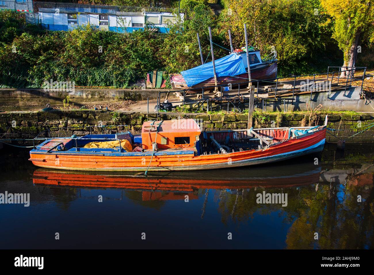 Old boat moored on the Ouseburn river in Newcastle upon Tyne Stock ...