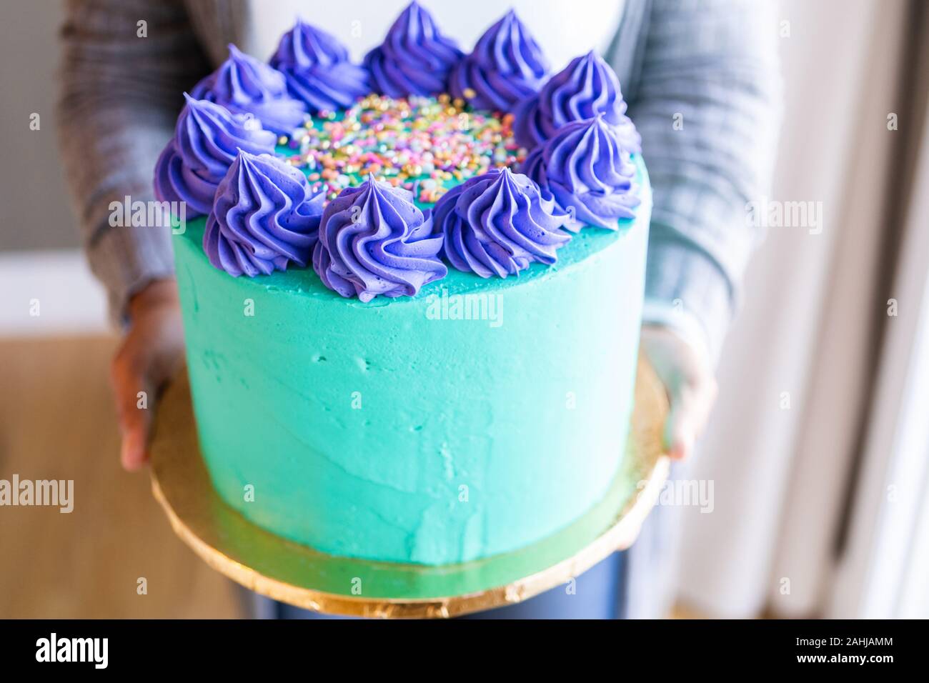 Birthday cake with turquoise buttercream and purple rosettes and ...