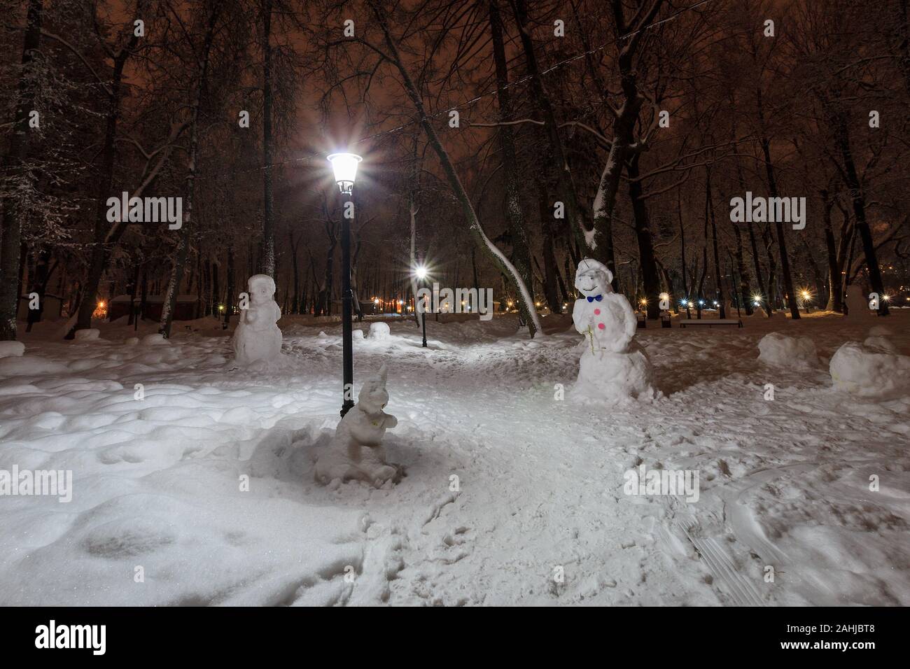 snowman at night park at winter season Stock Photo - Alamy