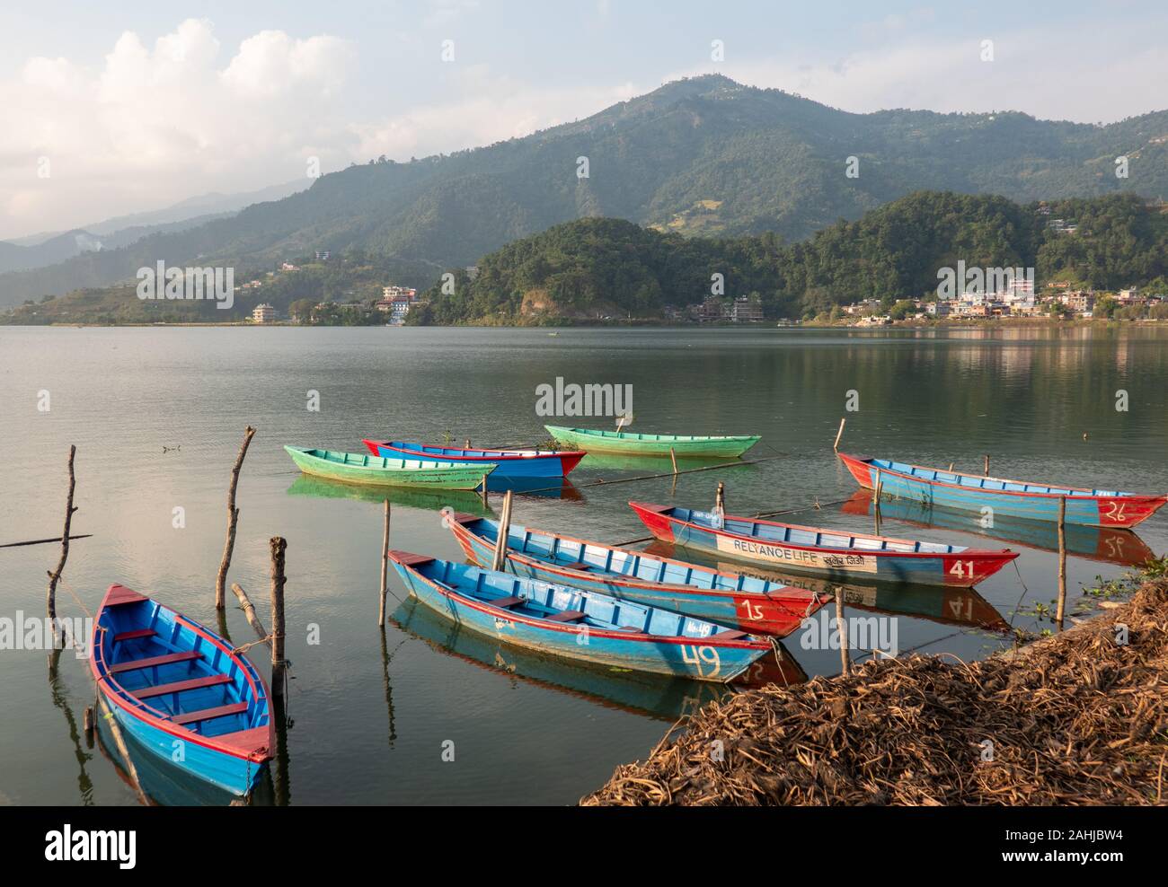 A bunch of boats floating on Fewa Lake in Pokhara, Nepal Stock Photo ...