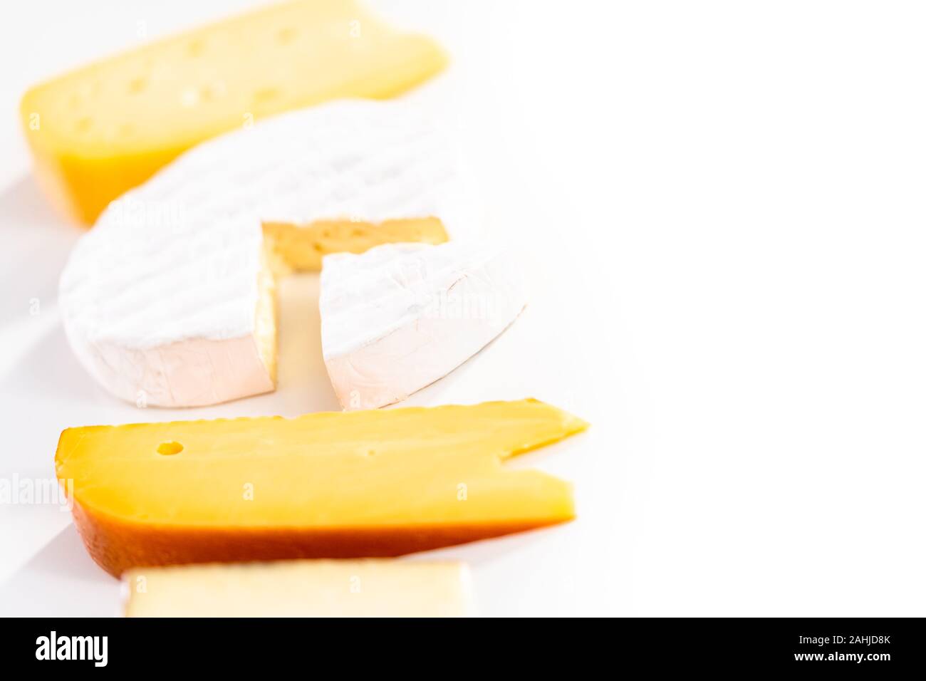 Variety of large wedges gourmet cheese on a white background Stock ...