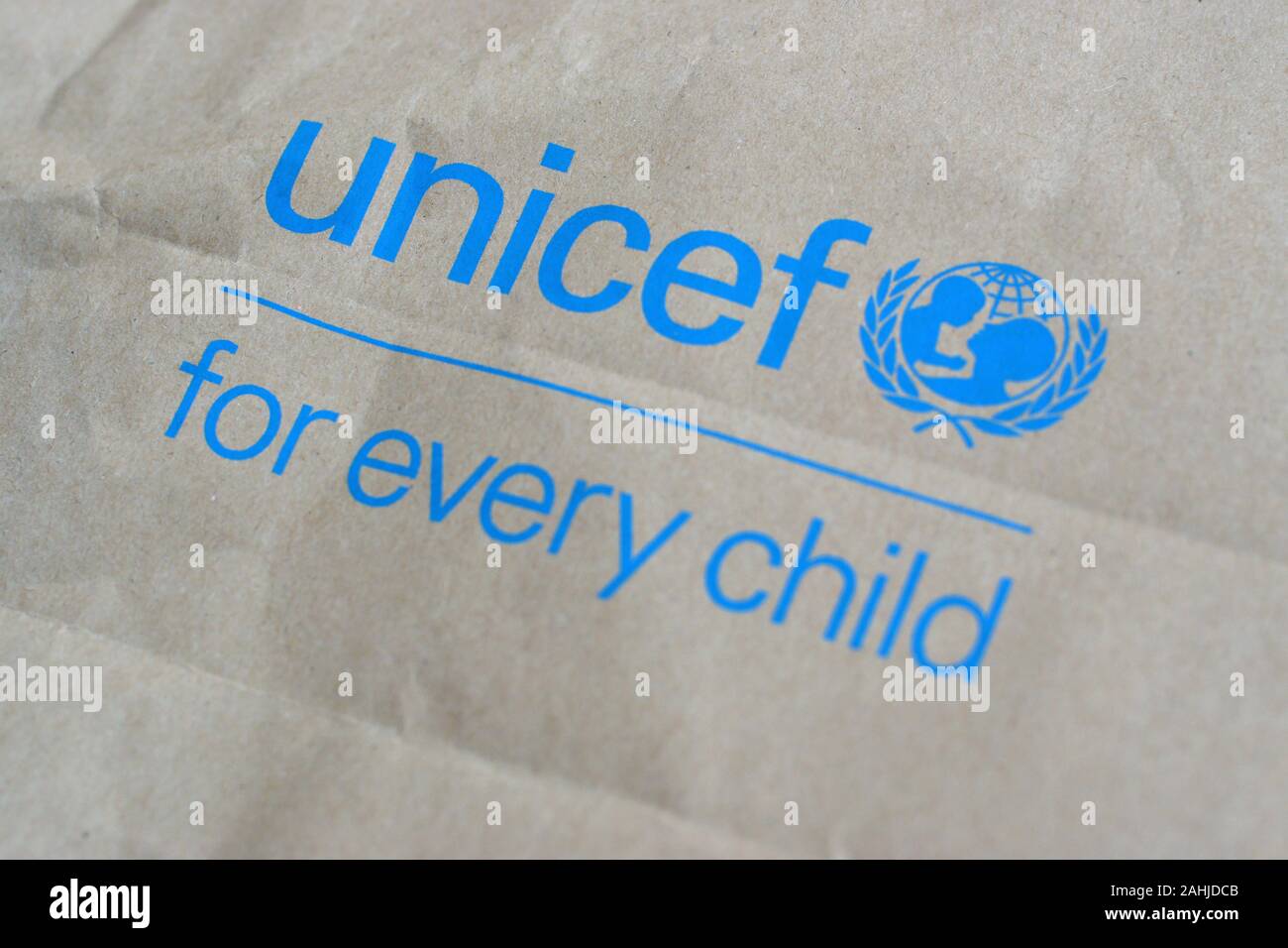 NY, USA - DECEMBER 29, 2019: Unicef blue logo on brown paper bag ...
