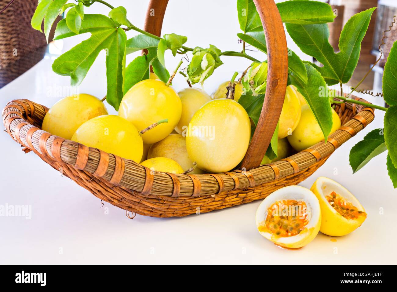 Passion fruit basket on white background Stock Photo - Alamy