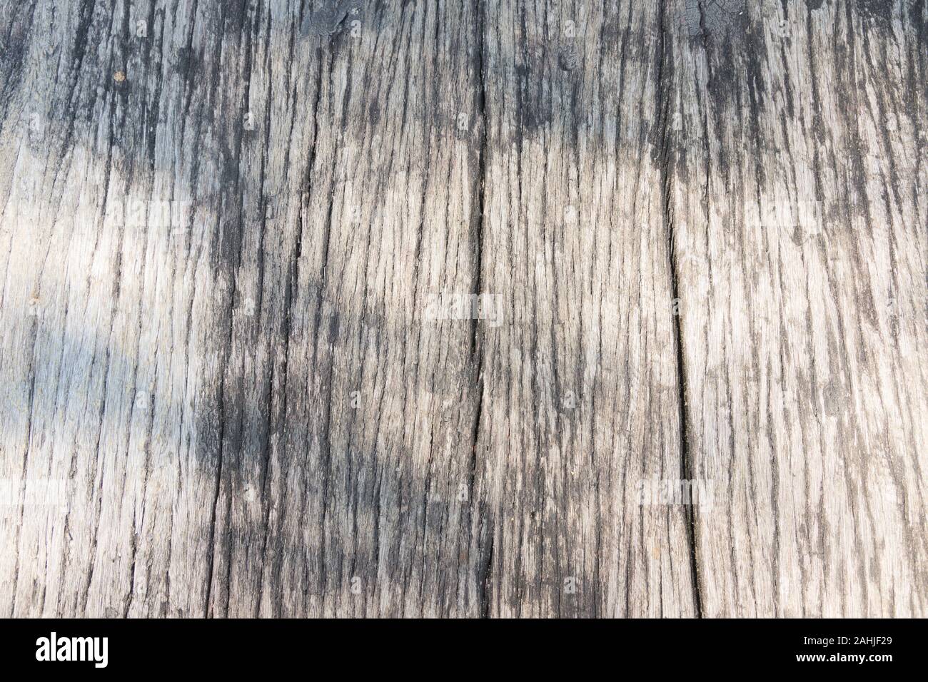 old Wooden pattern background on table got some black stain, with sun ...