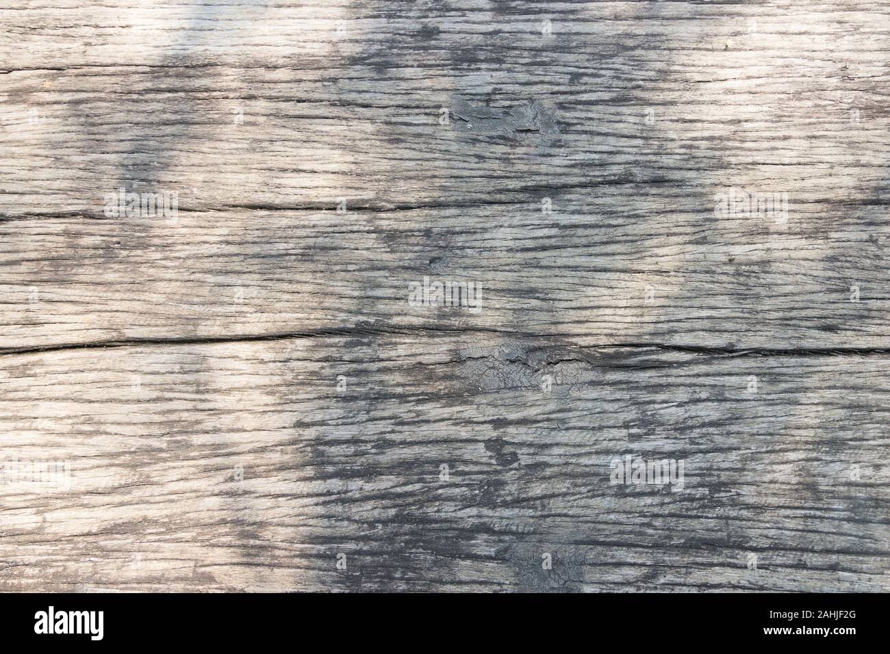 old Wooden pattern background on table got some black stain, with sun ...