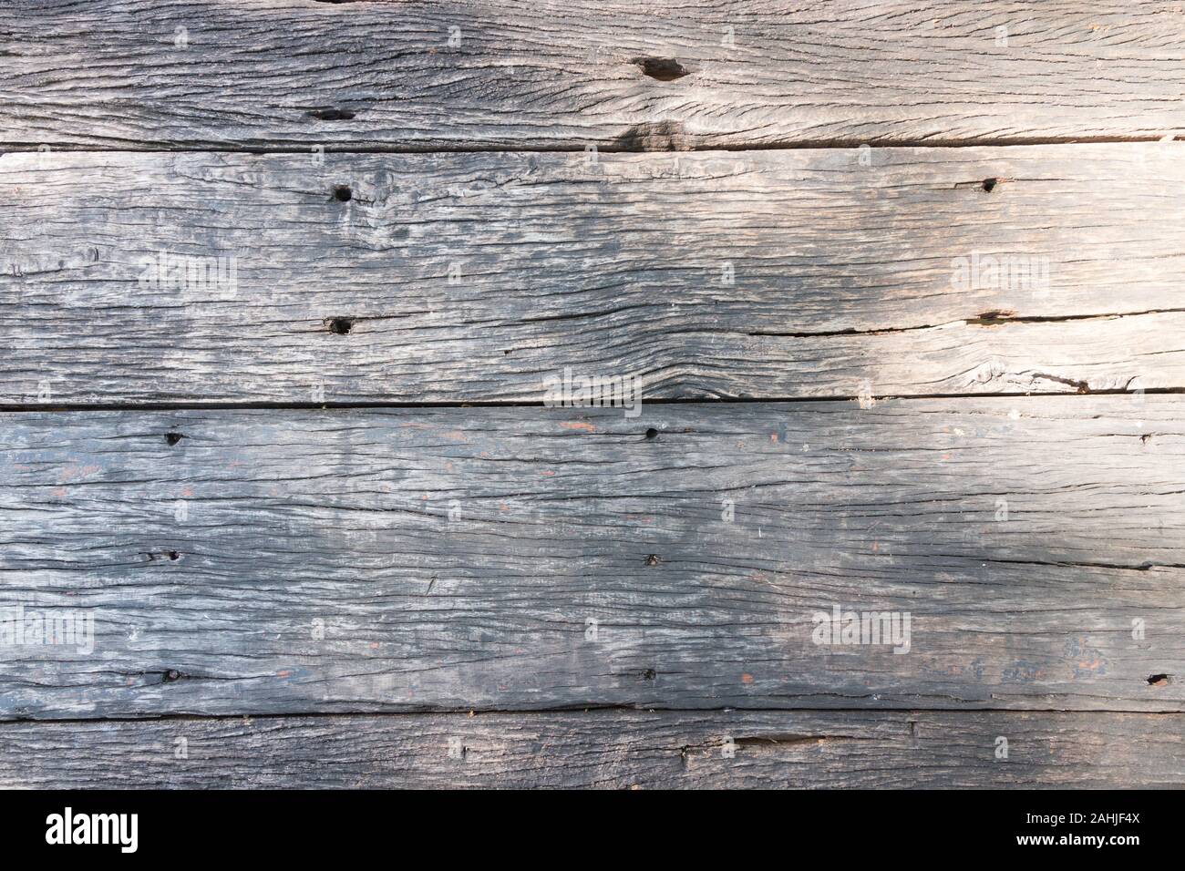 old Wooden pattern background on table got some black stain and spot ...