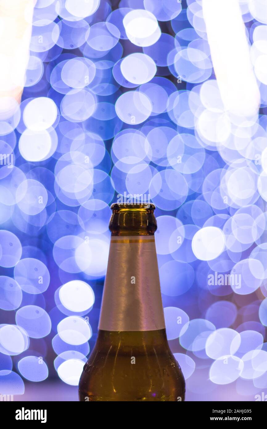 top of Beer bottle with blur white led light on blue background Stock ...
