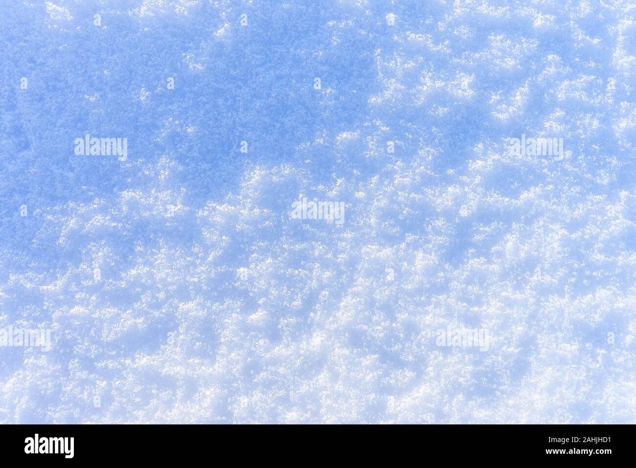 Snow texture at sunny winter day. Abstract background with shadows and ...