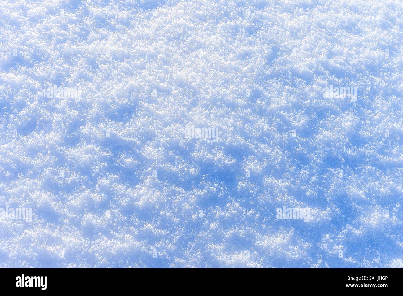 Snow texture at sunny winter day. Abstract background with shadows and ...
