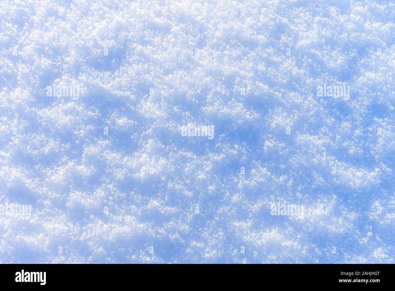 Snow texture at sunny winter day. Abstract background with shadows and ...
