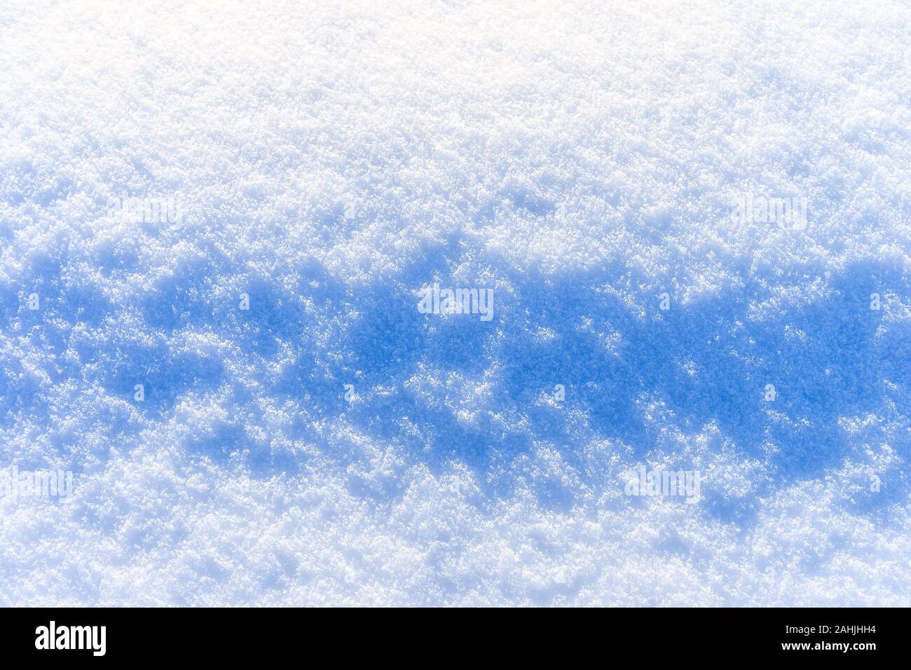 Snow texture at sunny winter day. Abstract background with shadows and ...