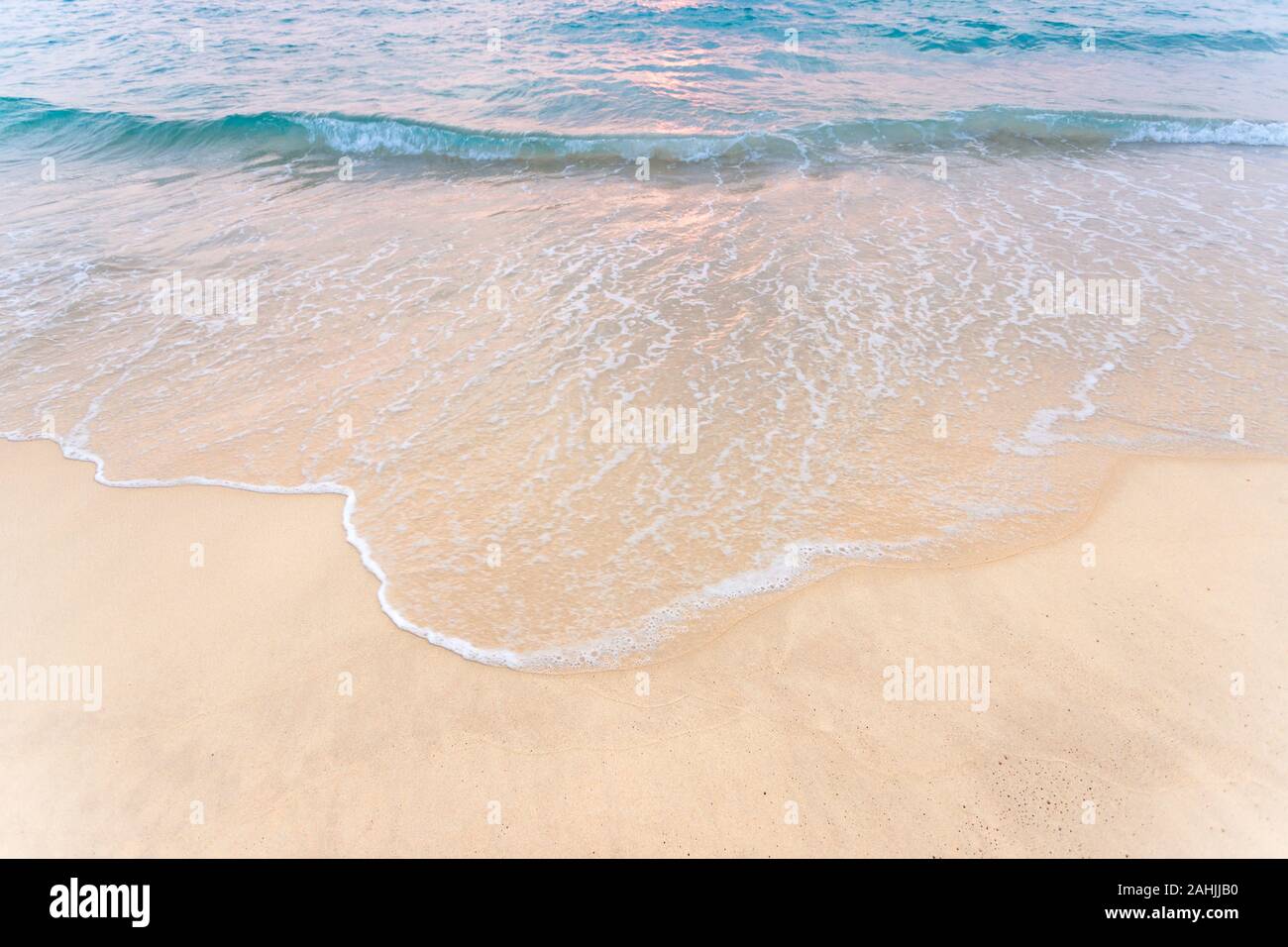 soft seashore with small wave come up make some foam, get some sunset ...