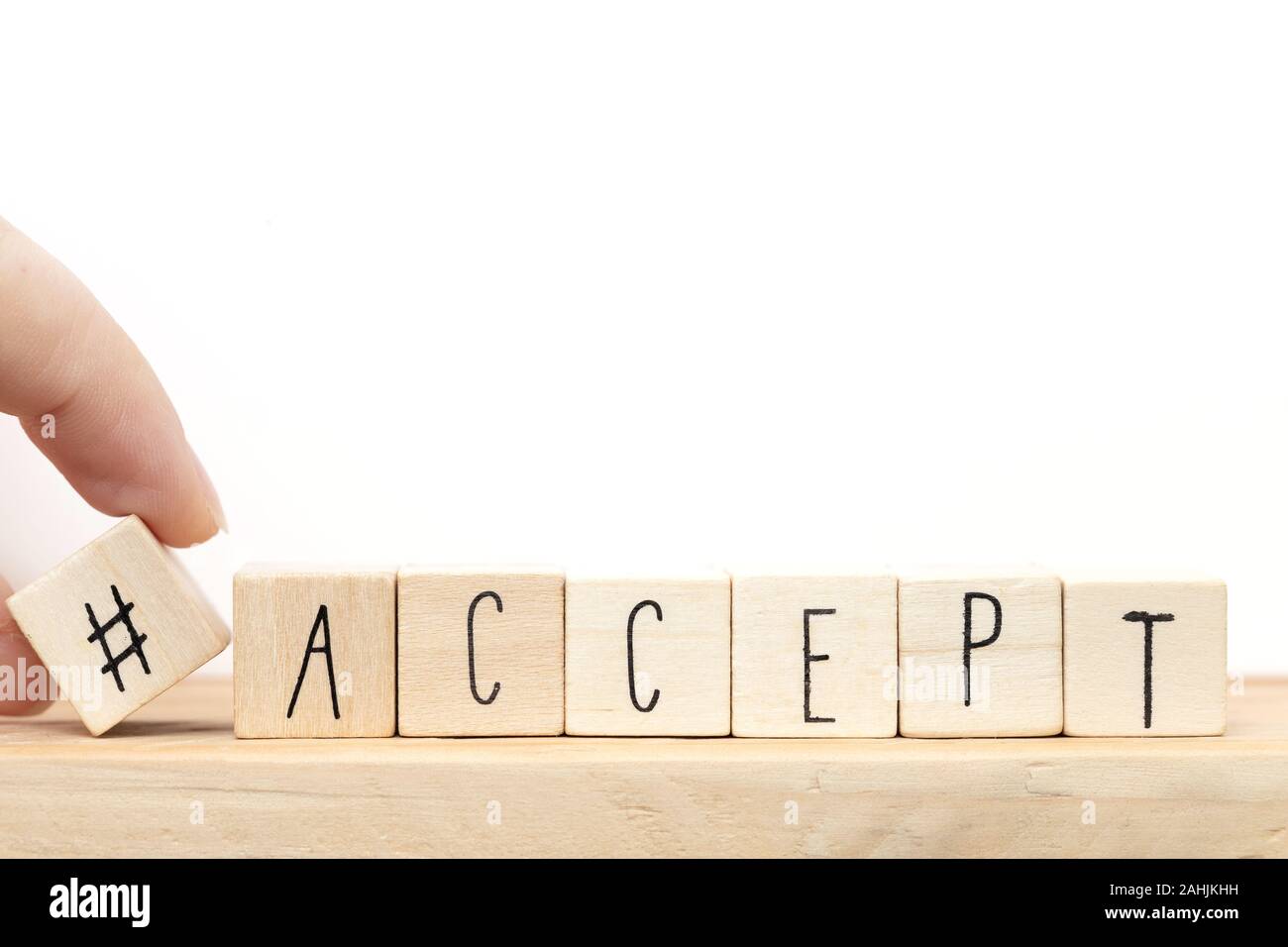 Wooden cubes with a hashtag and the word Accept, social media concept ...