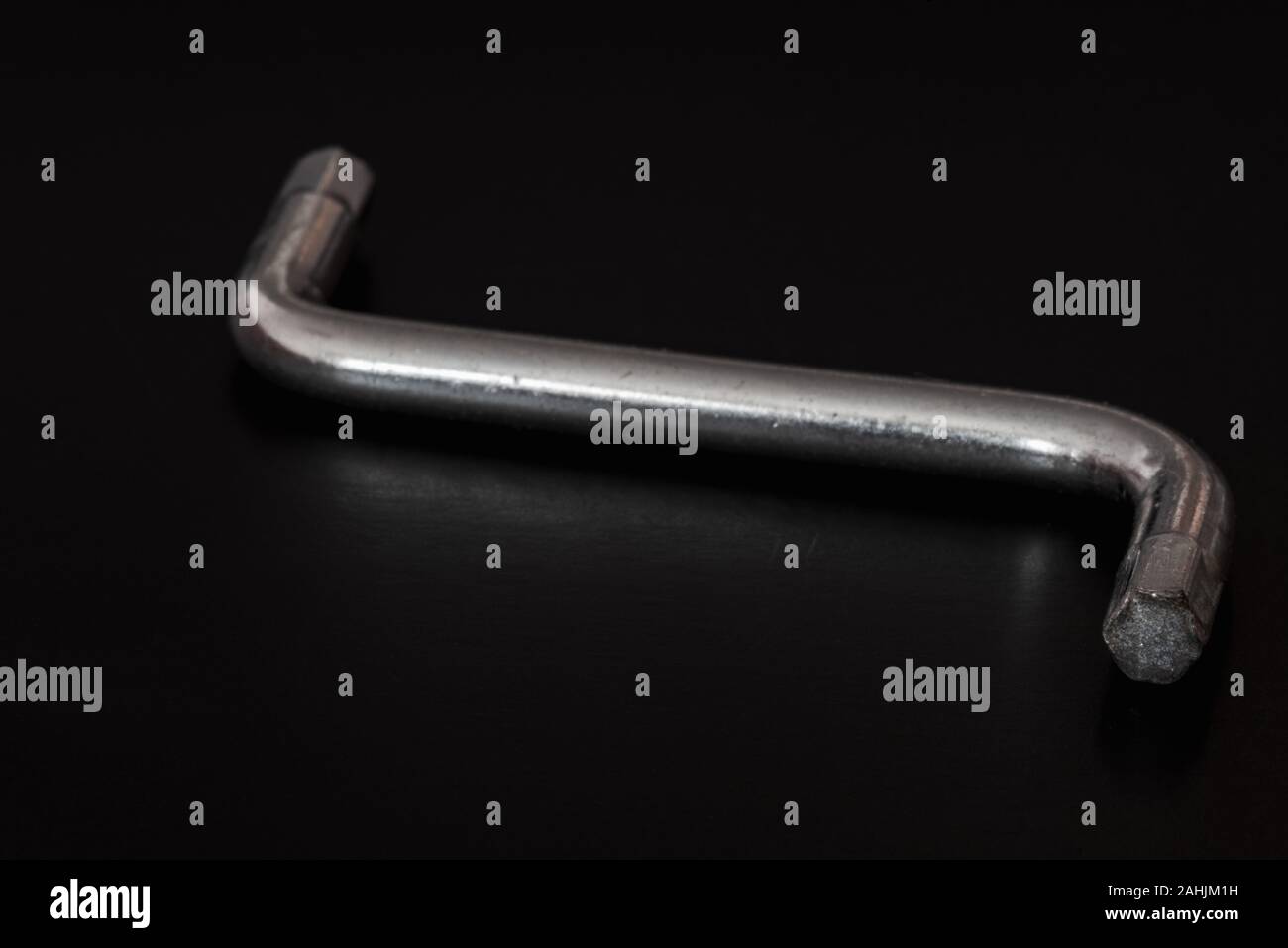 hexagon socket screw s shaped allen key in a solid background Stock ...