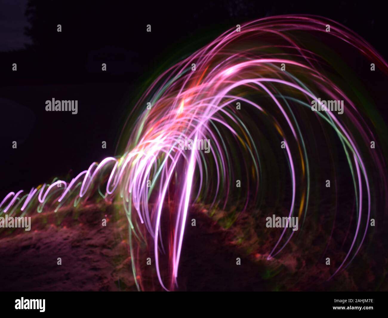 long exposure, curves and waves against a black background Stock Photo ...