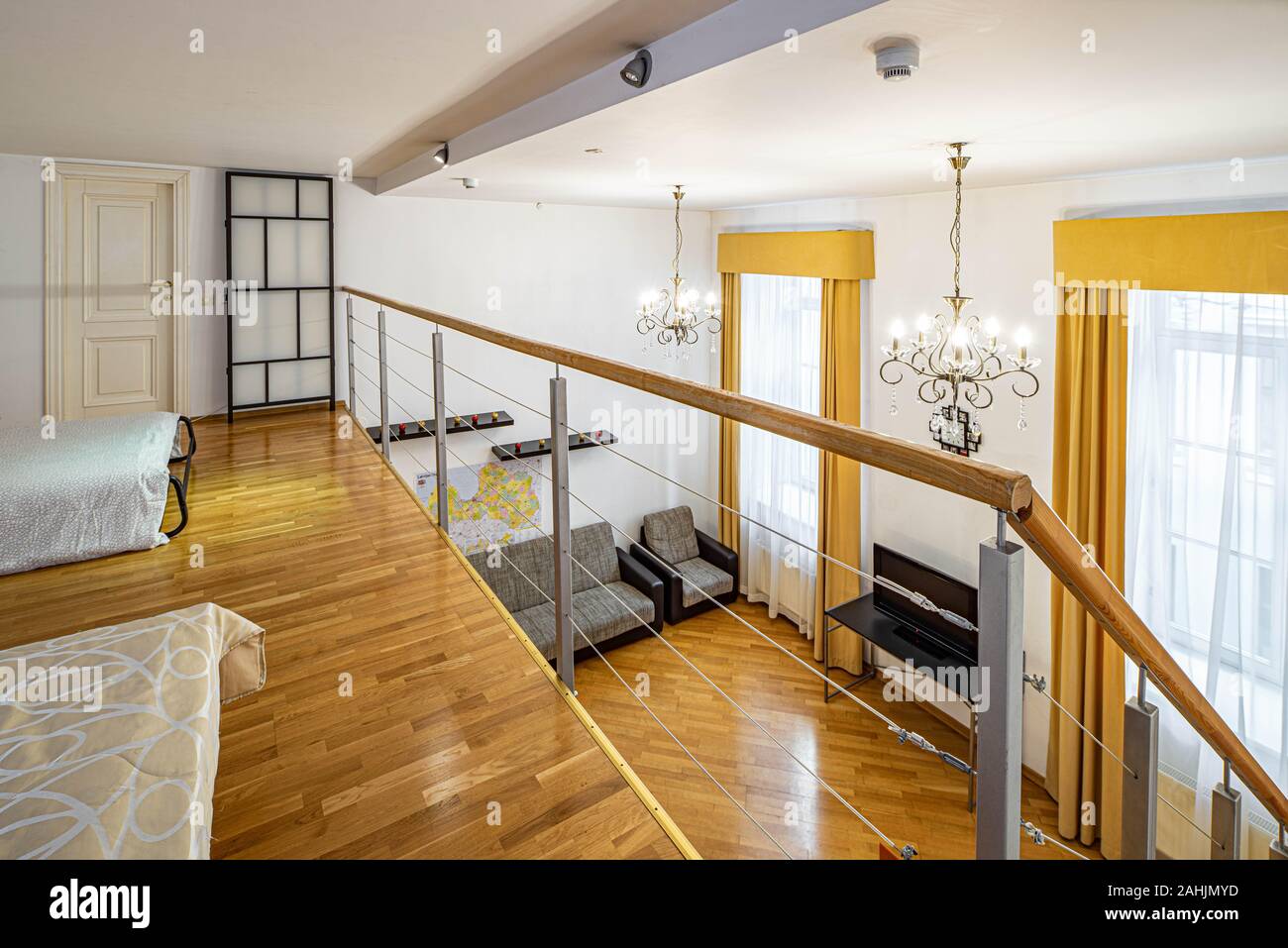 Modern interior of private house. View of living room from the second ...