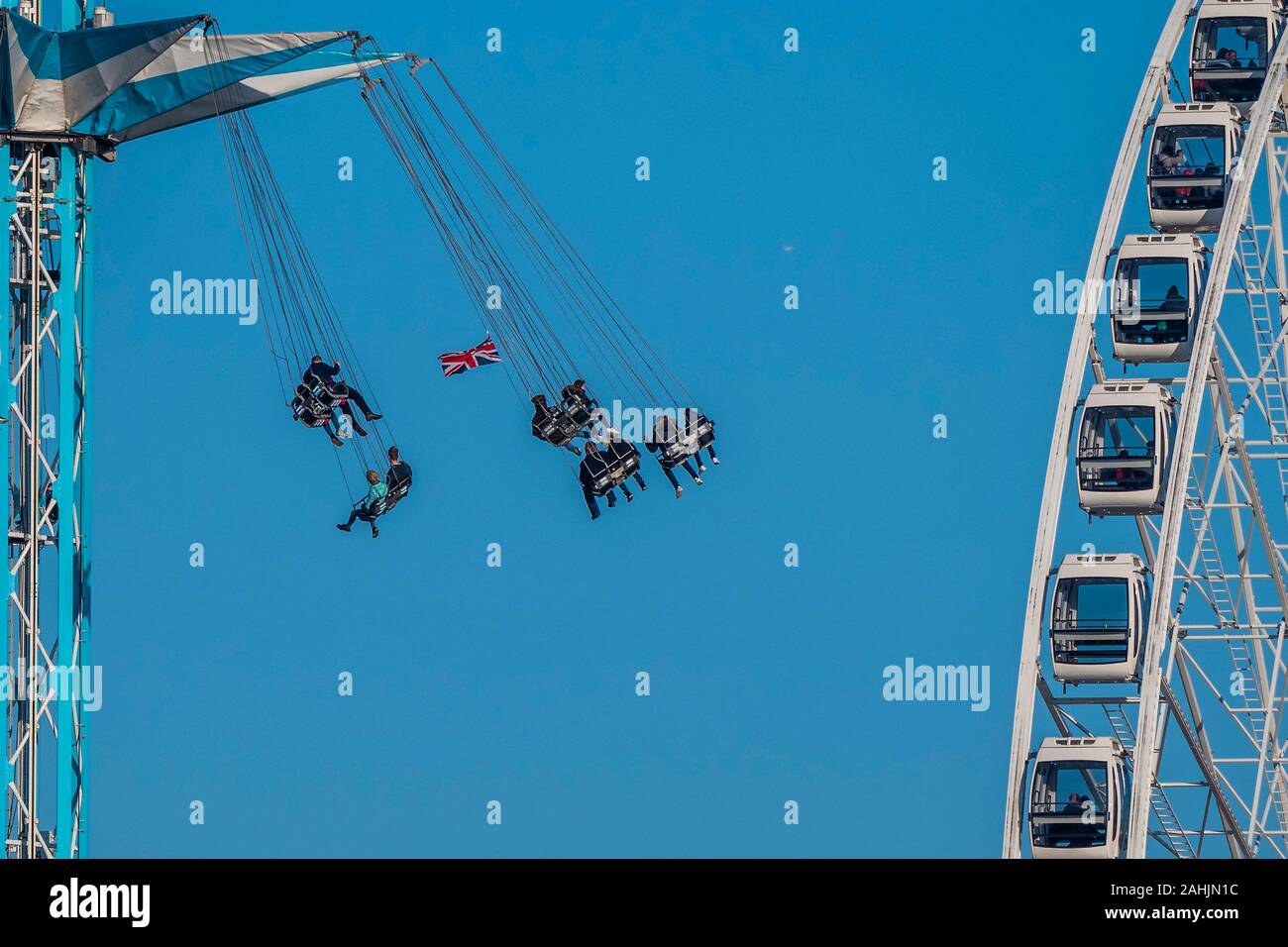 Tourists enjoy flying high on the rides in Winter Wonderland in Hyde ...
