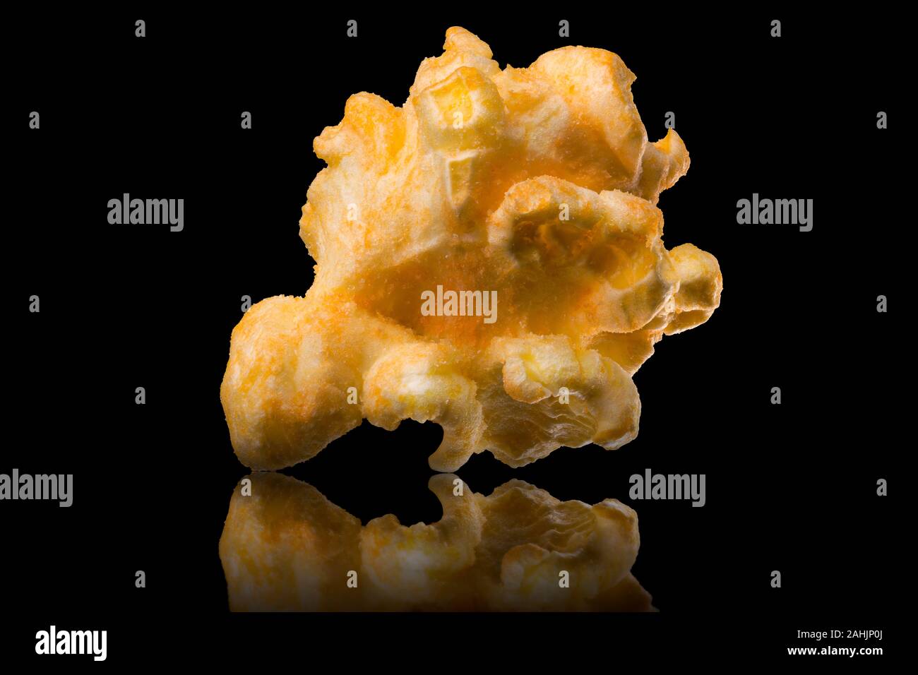 Single popped popcorn on a black backgroundwith clipping path Stock ...