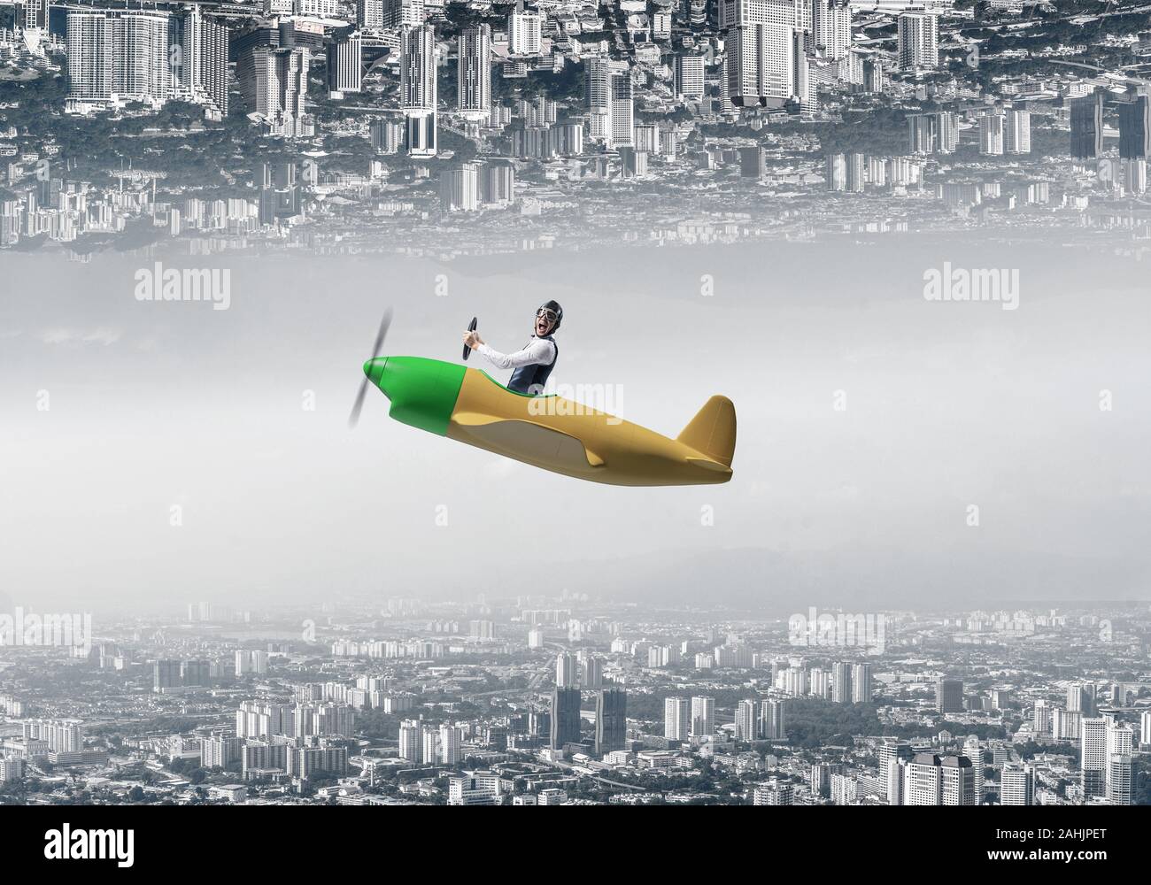 Businessman flying in small airplane. Two modern urban worlds located ...