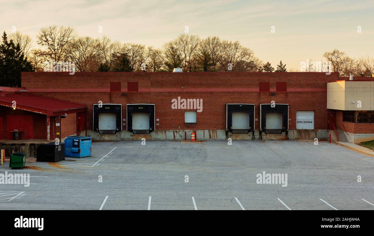 Establishing shot of an empty warehouse building with cargo loading ...