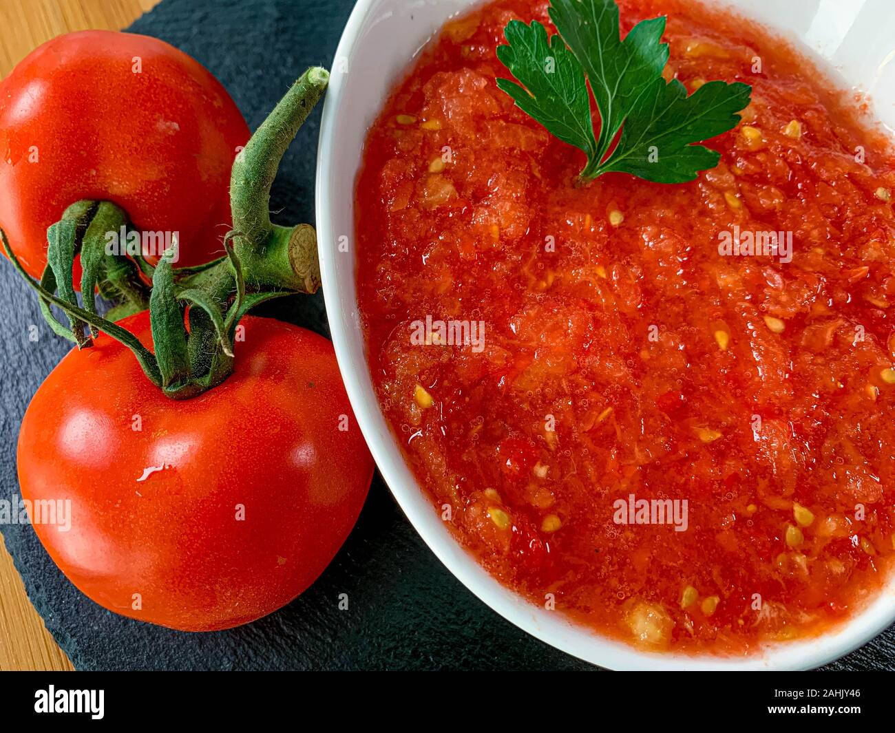 Homemade tomato paste in a white bowl , view from above Stock Photo - Alamy