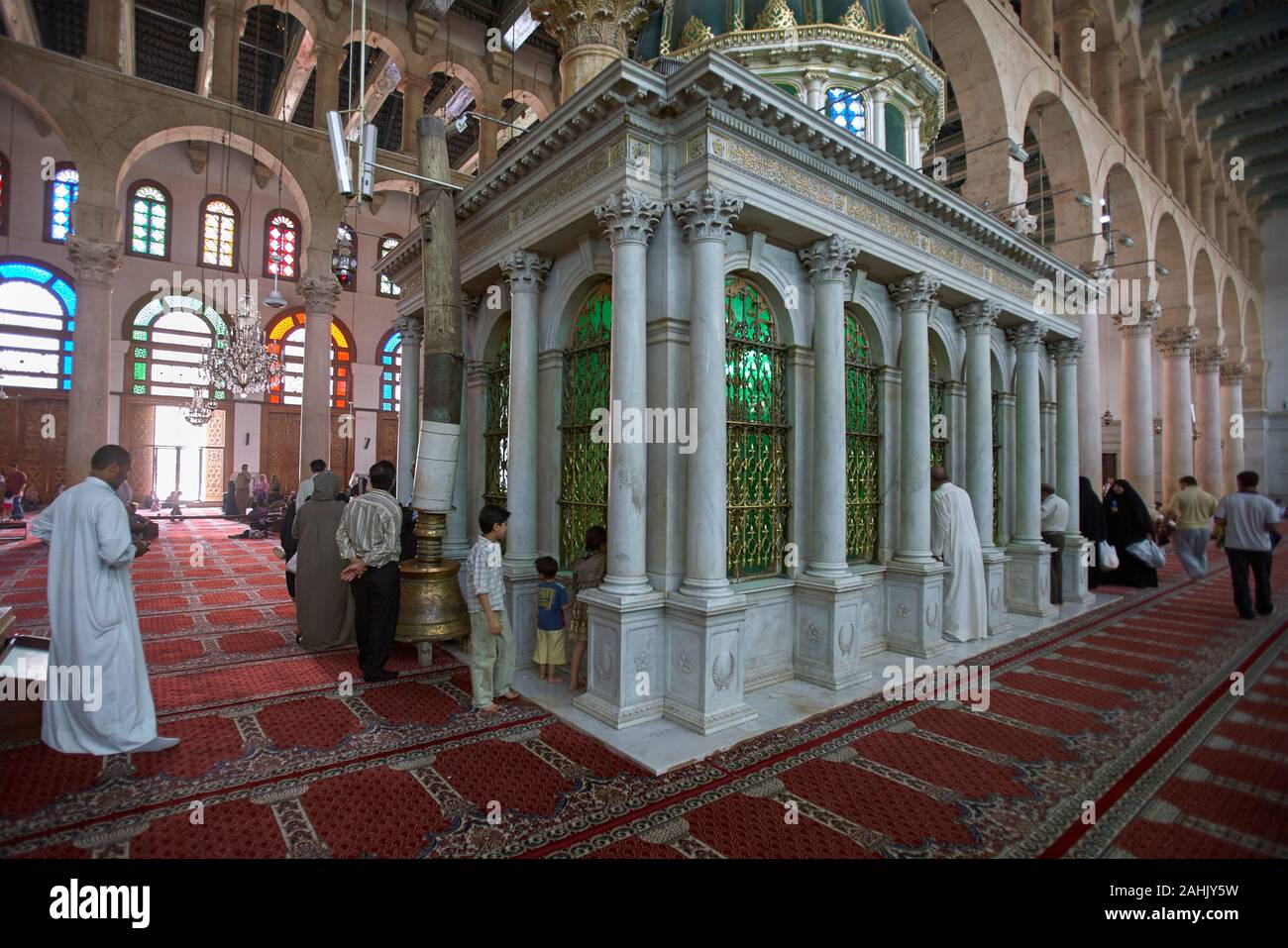 Faithfuls men praying in front of the tomb of John the Baptist in the ...