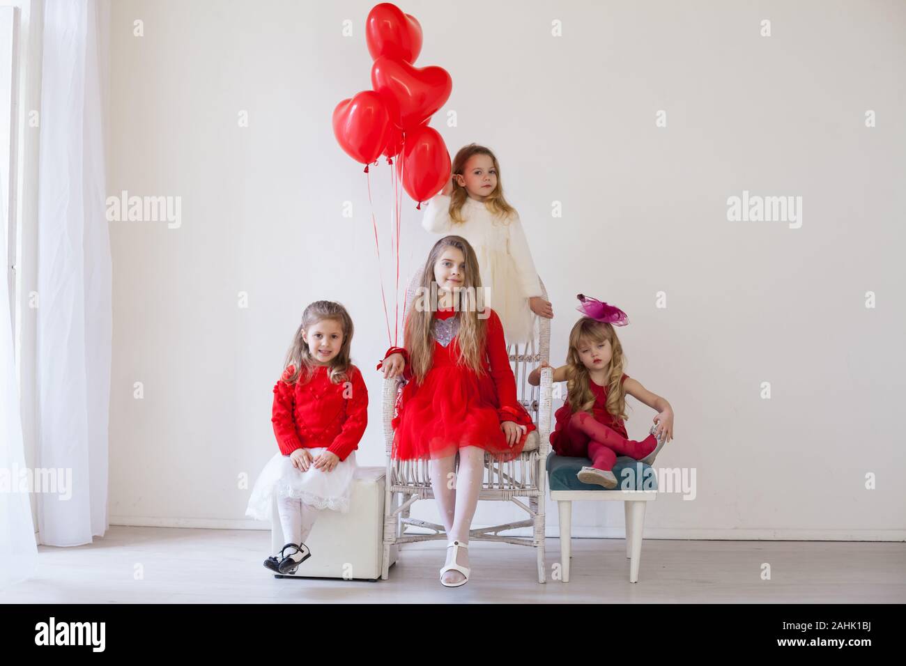 Children with red balloons on birthday party Stock Photo - Alamy