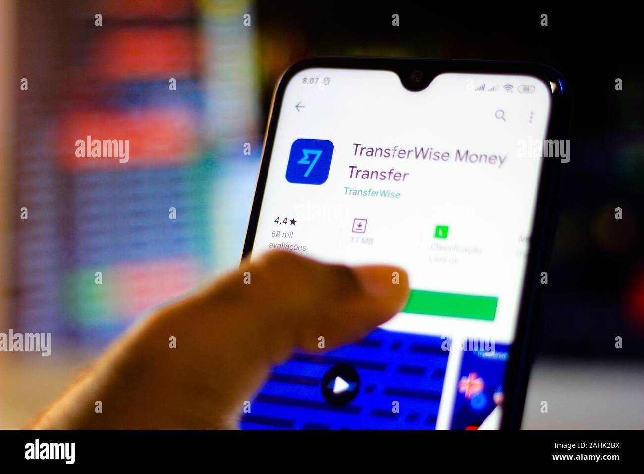 In this photo illustration the TransferWise app and logo is seen ...