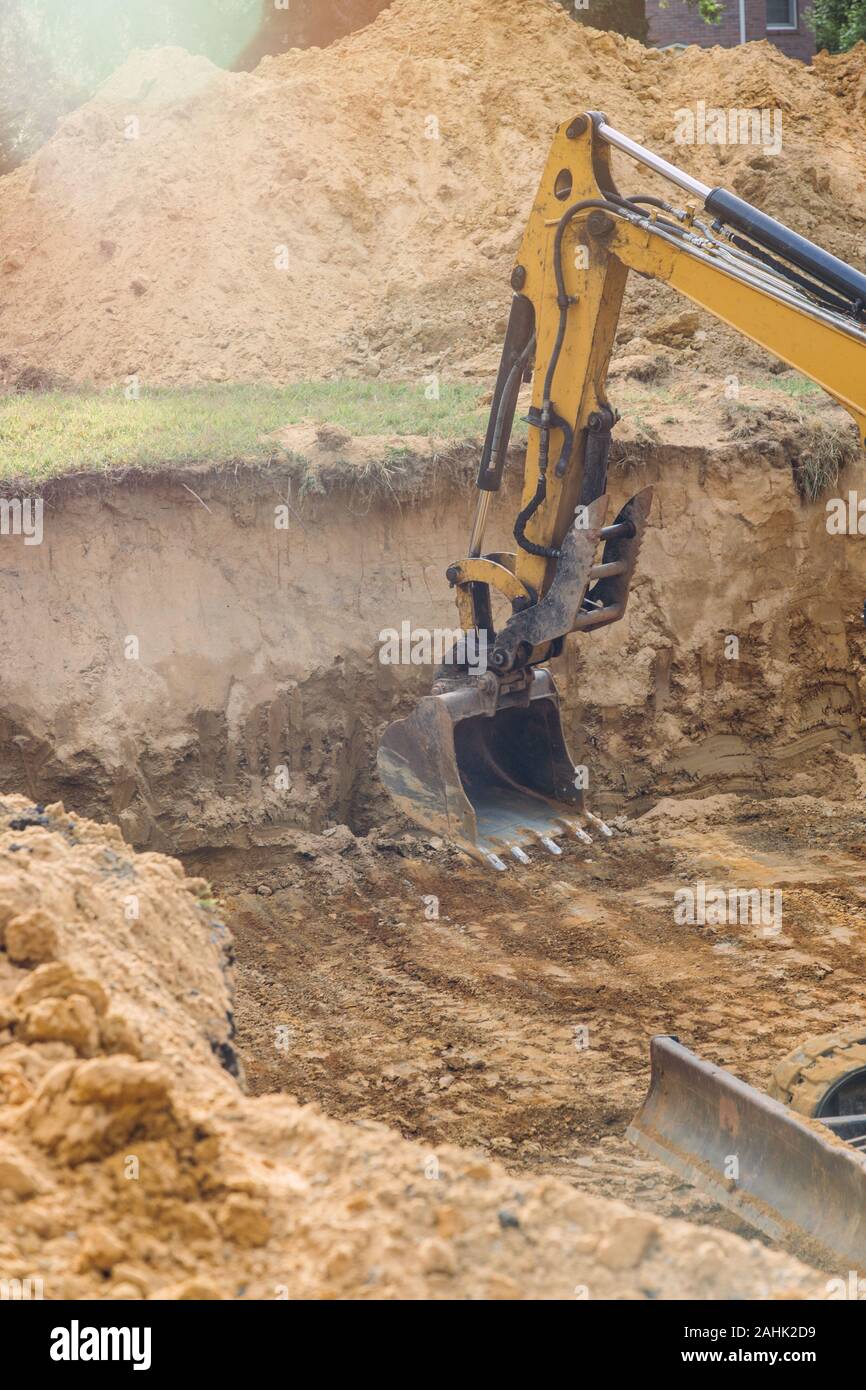 Industrial excavator in the construction of an underground foundation ...