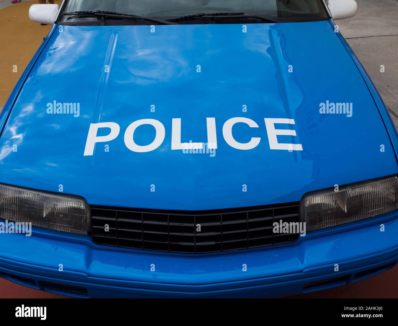 Detail of the "police" inscription on the hood of a historic police car ...