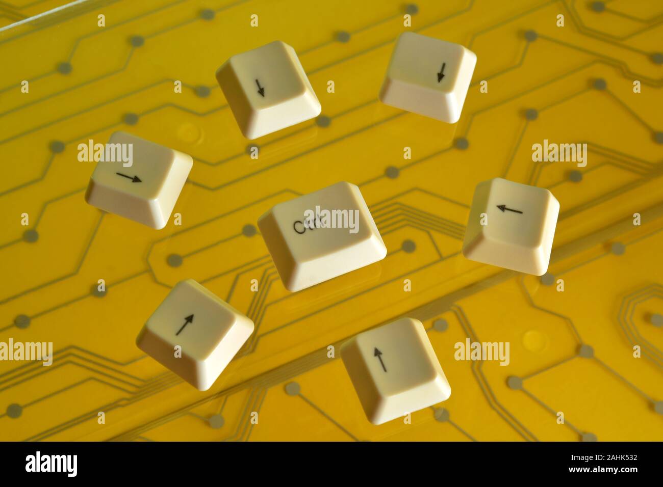 Keyboard arrow keys surround the the key CTRL on yellow electric ...