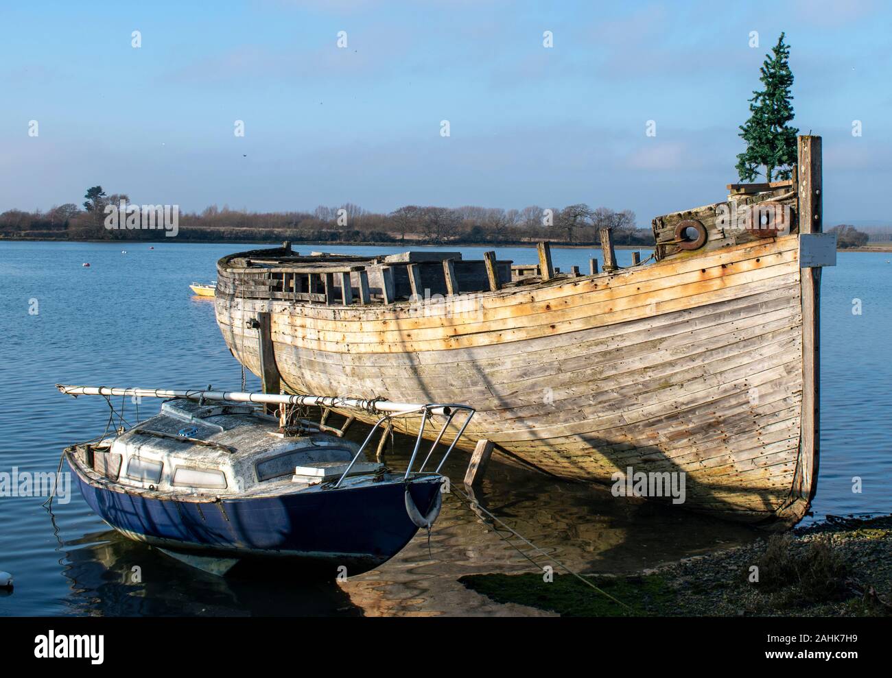 Dell Quay near Chichester, a view of two old boats both in need of ...