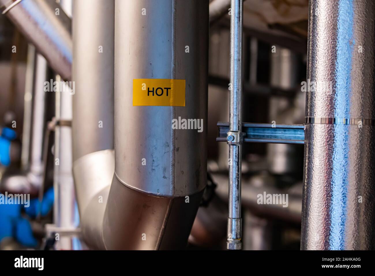 metal stainless steel large big pipes with hot yellow sign, modern ...