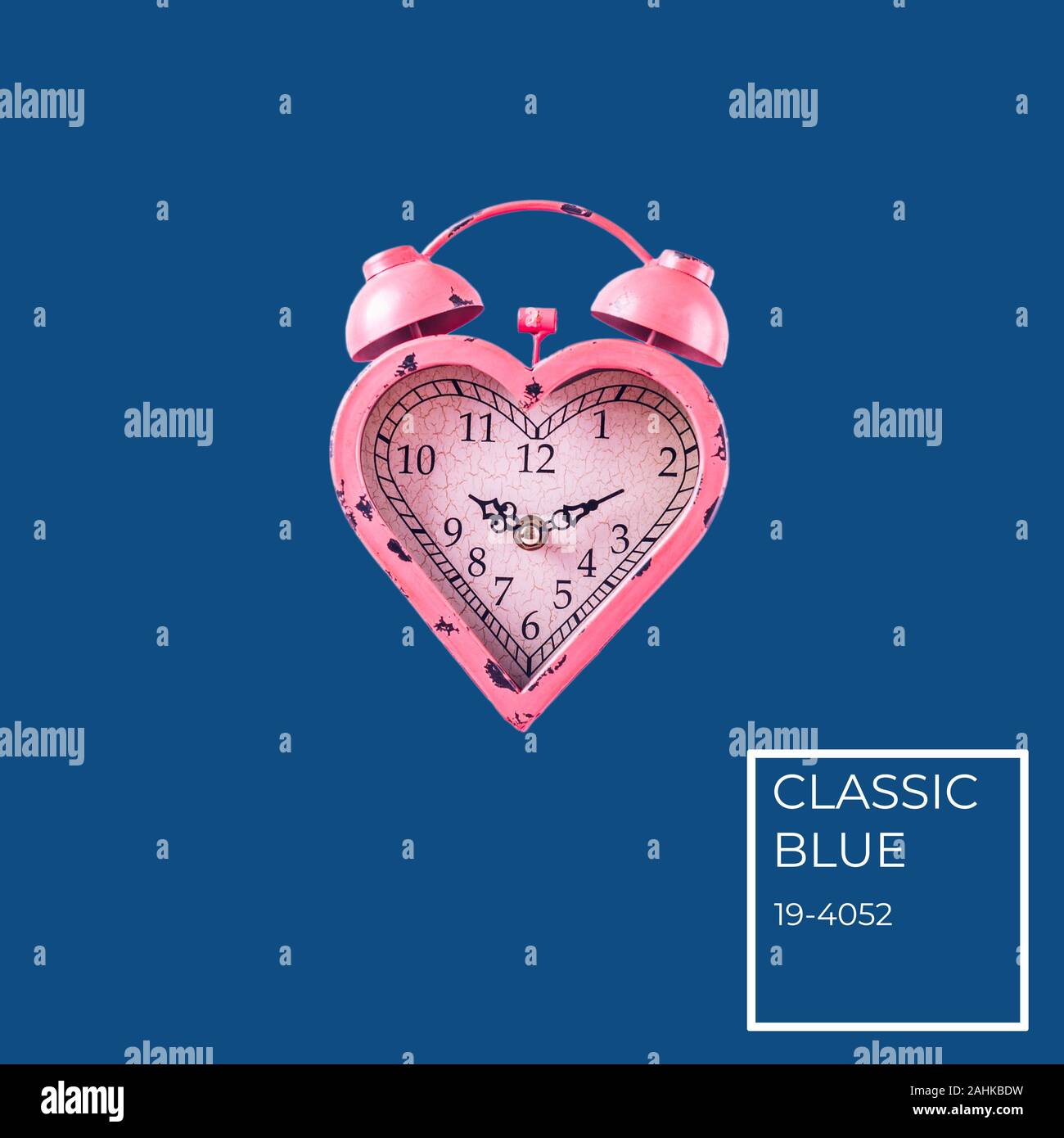 Heart shaped pink clock on classic blue background. Valentines day and ...