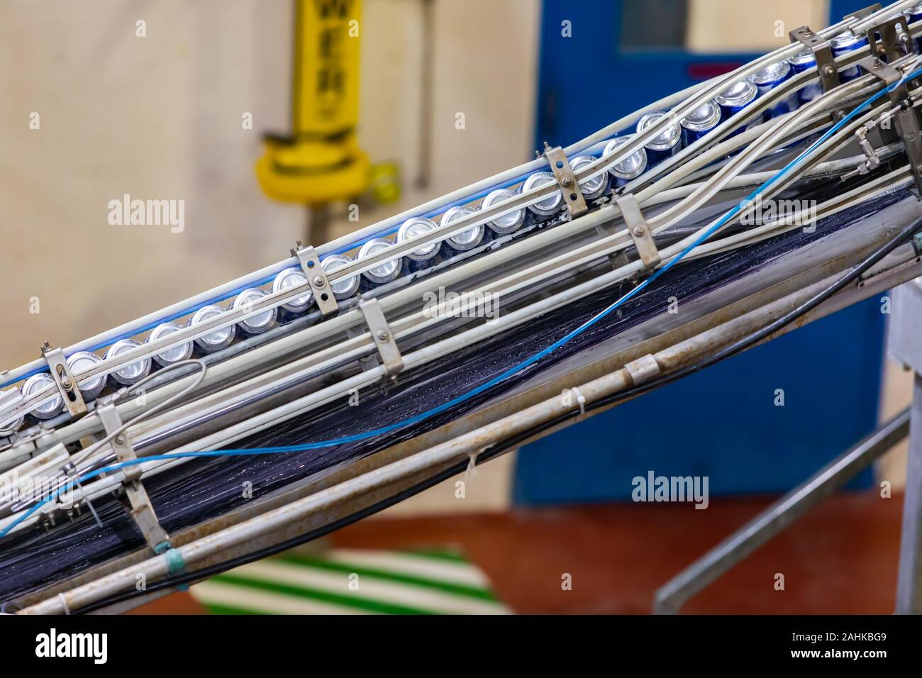 aluminum beer cans on packaging machine, pipes and tubes of Conveyor ...