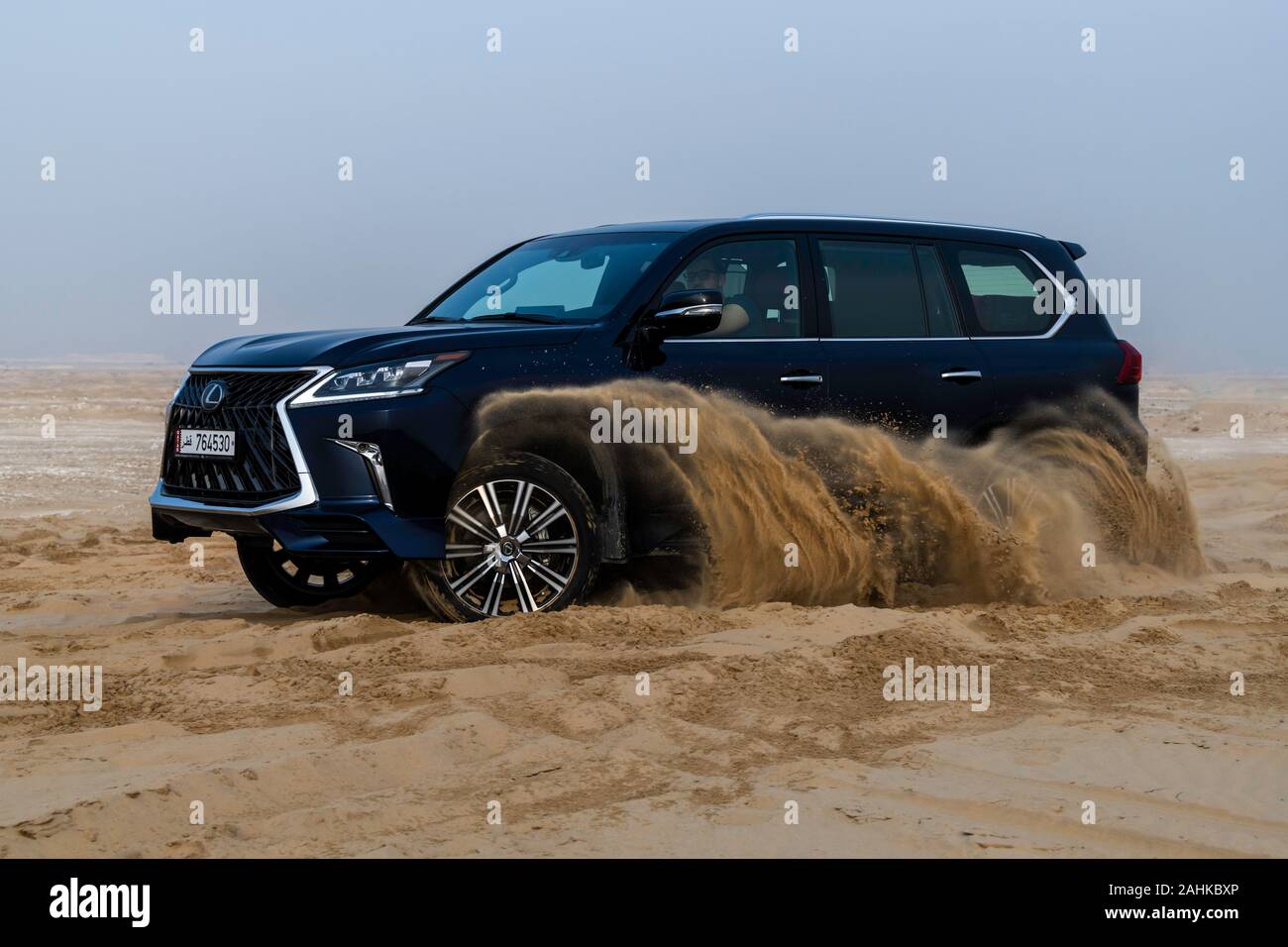 Blue Lexus LX 570 Dune Bashing at Desert Stock Photo - Alamy