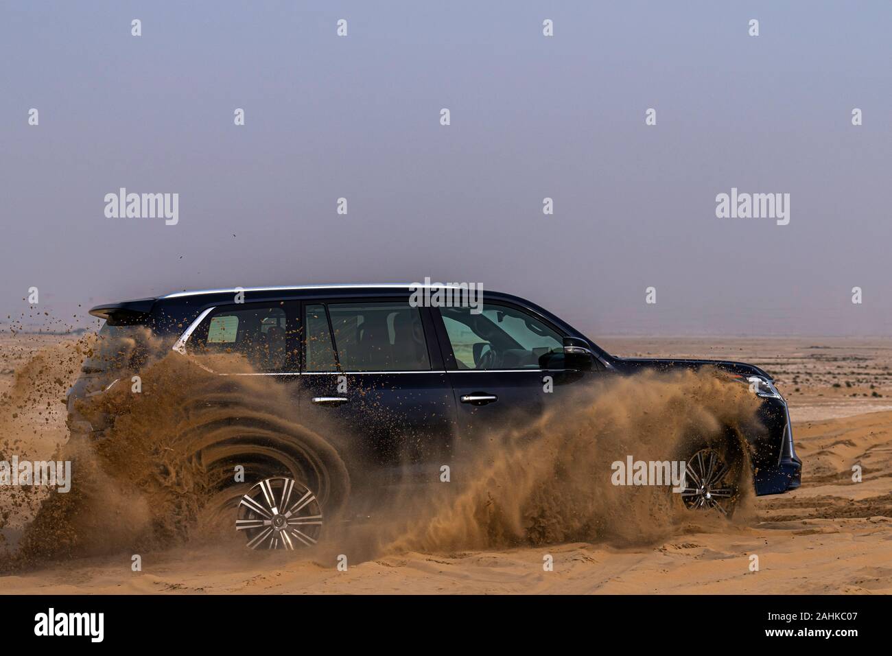 Blue Lexus LX 570 Dune Bashing at Desert Stock Photo - Alamy