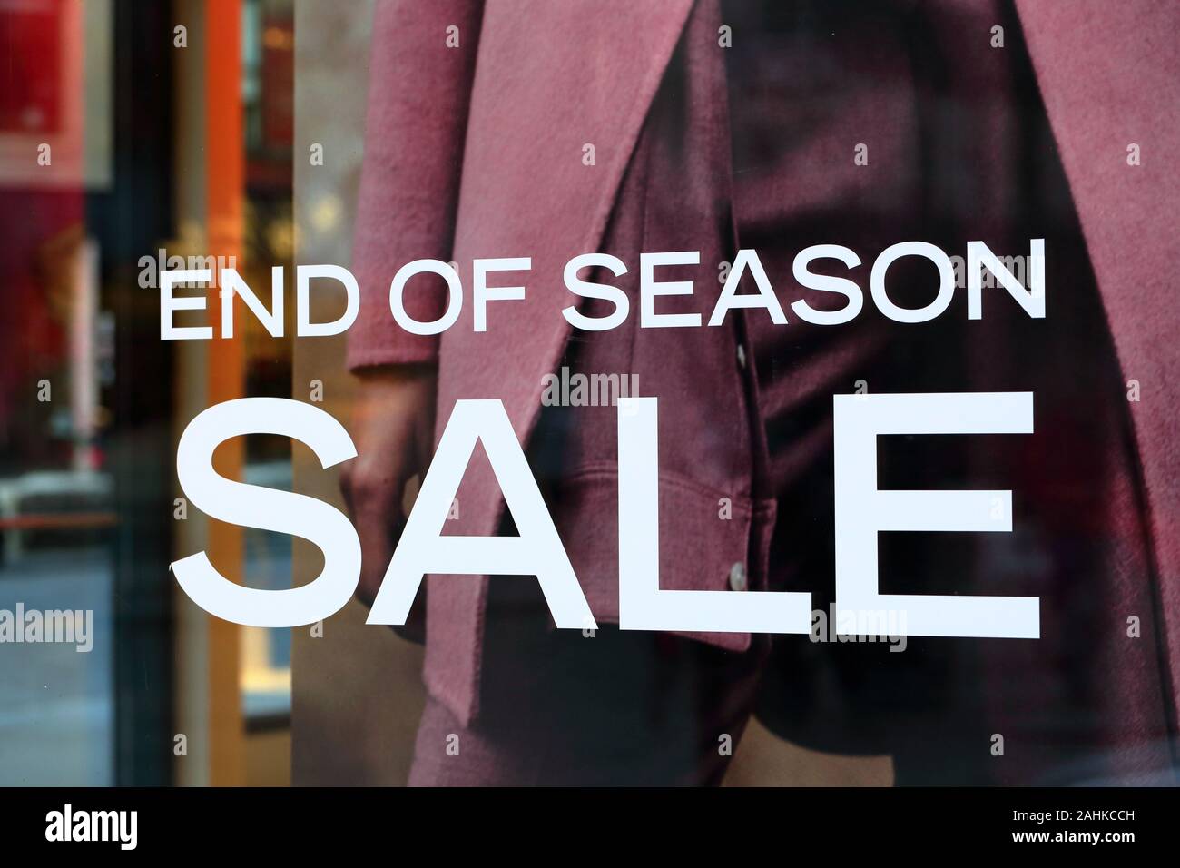 A window display announcing "End of Season Sale Stock Photo - Alamy
