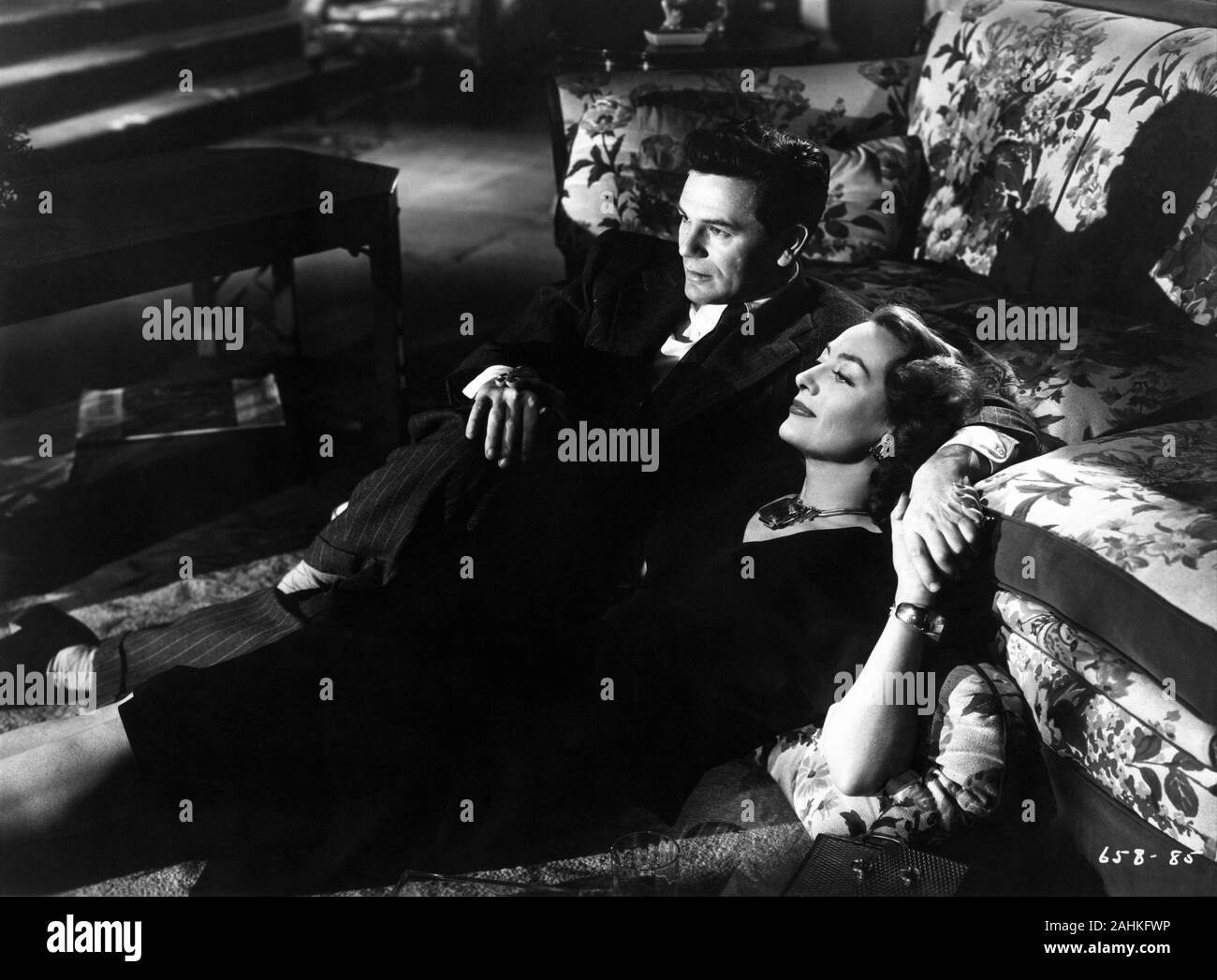 JOAN CRAWFORD as Helen Wright and JOHN GARFIELD as Paul Boray in ...