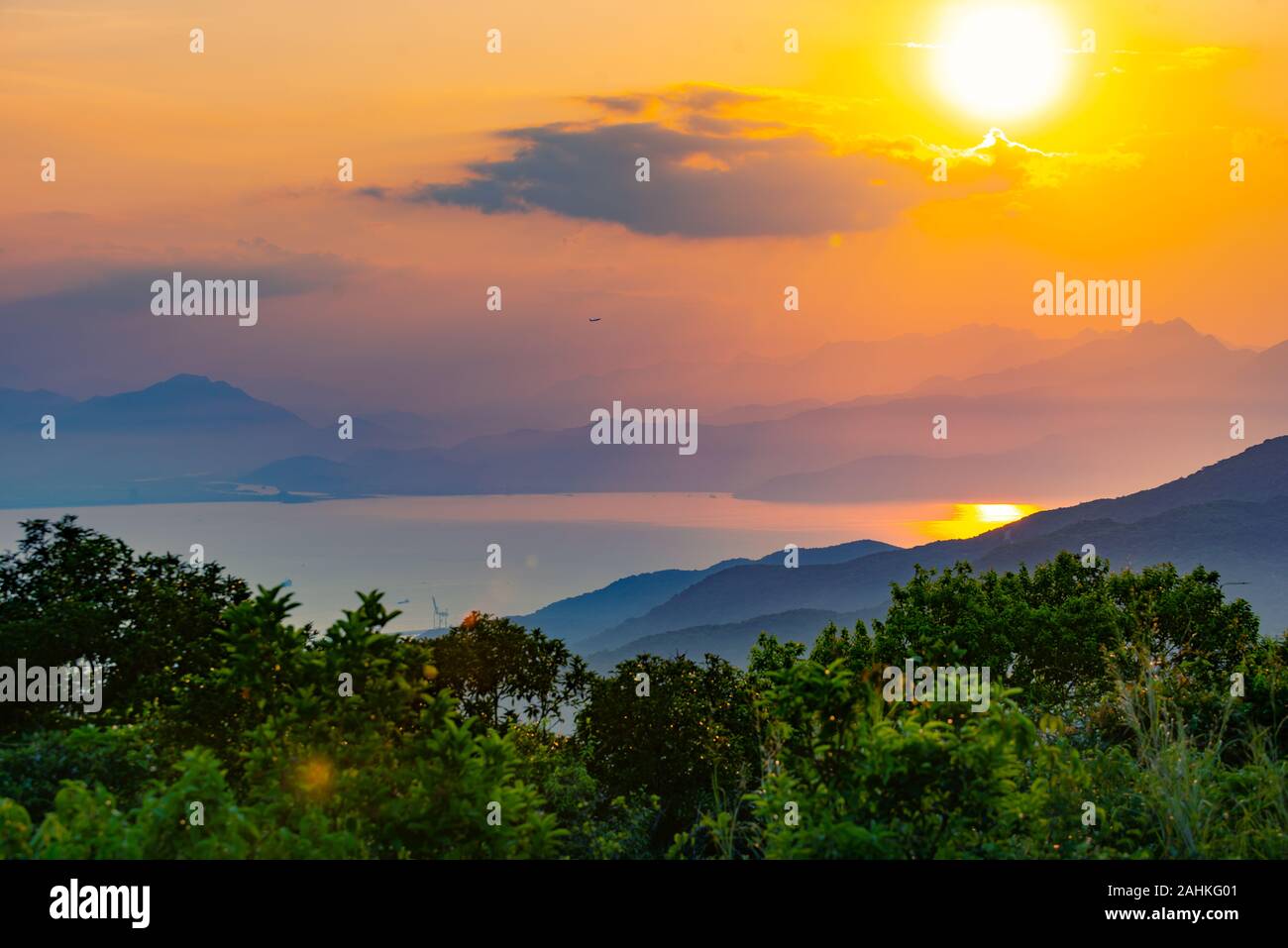 Beautiful sunset over The Da Nang Bay and Ba Na Hills as seen Ban Co ...