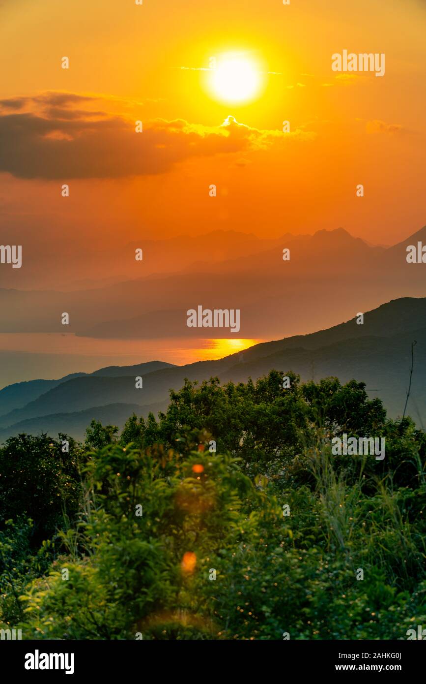 Beautiful sunset over The Da Nang Bay and Ba Na Hills as seen Ban Co ...