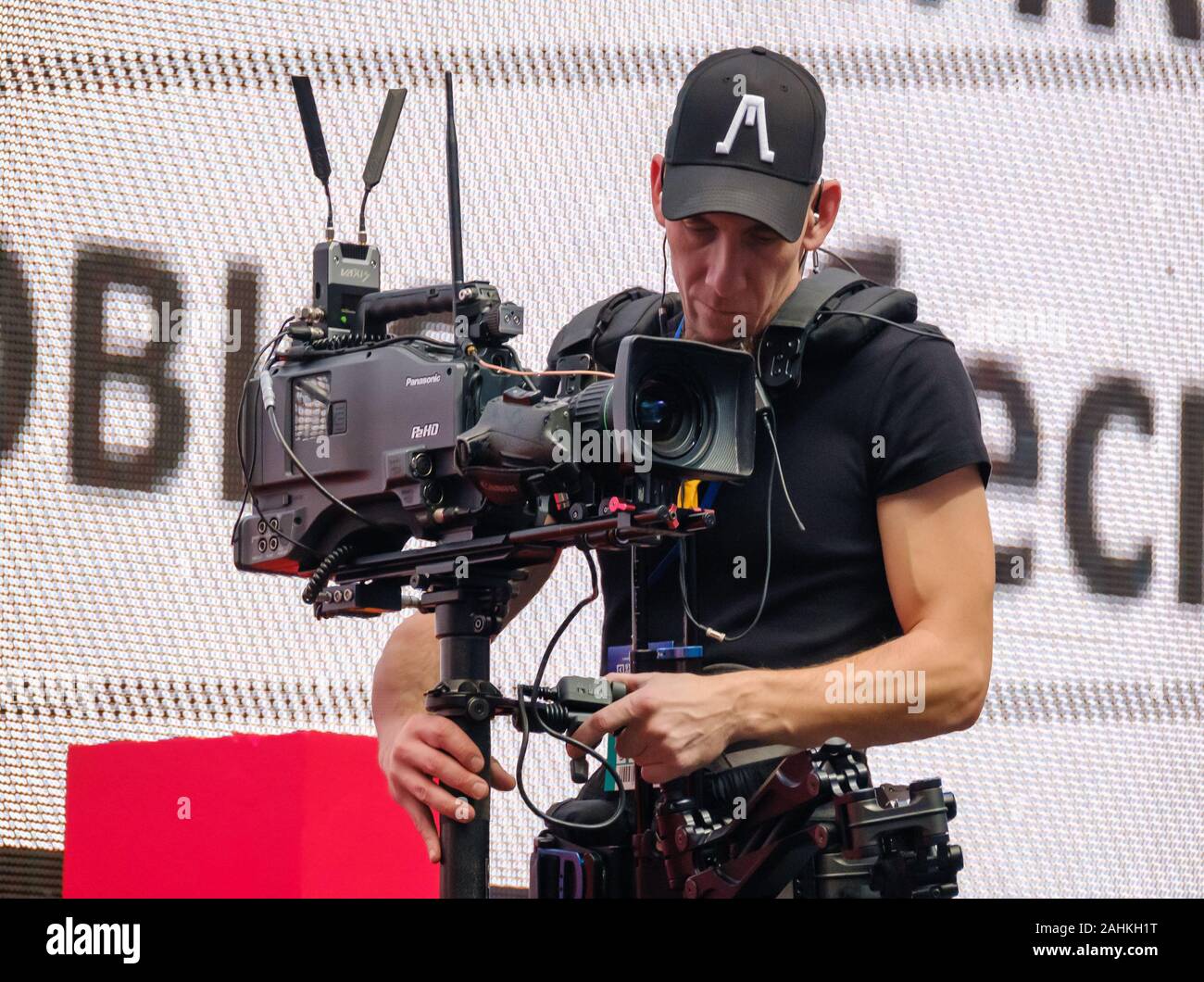 Steadicam camera man online broadcasting from stage Stock Photo - Alamy