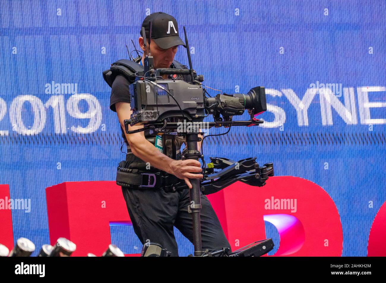 Steadicam camera man online broadcasting from stage Stock Photo - Alamy
